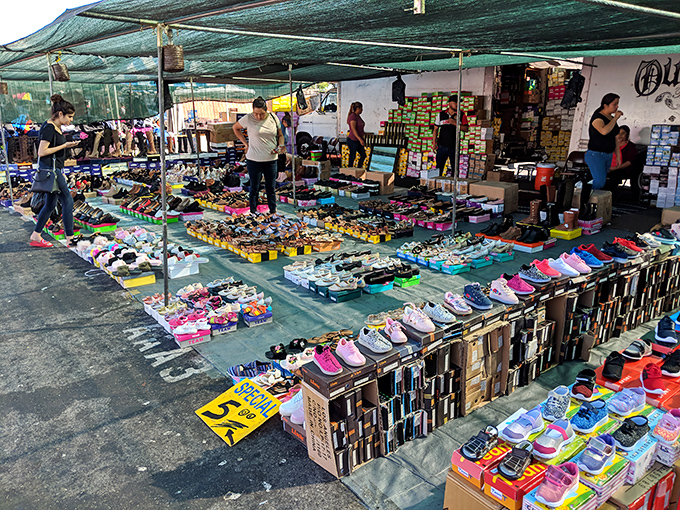 Sneaker paradise spreads across the asphalt where every step could lead to your perfect pair. 