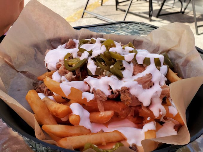 These aren't just loaded fries—they're a commitment. The perfect relationship between potato, meat, cheese, and jalapeños, drizzled with a sauce that ties everything together.