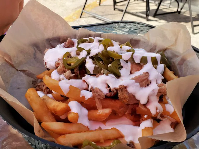 These aren't just loaded fries—they're a commitment. The perfect relationship between potato, meat, cheese, and jalapeños, drizzled with a sauce that ties everything together.