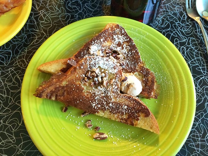 French toast that doesn't just say good morning—it sings it with a sprinkle of powdered sugar and what appears to be a dollop of pure happiness.