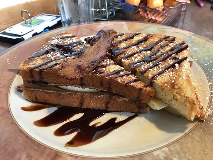 French toast that's dressed for success with chocolate drizzle. Like a breakfast dessert that somehow feels justified before noon.