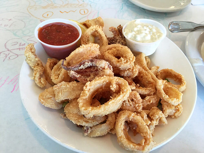 These golden calamari rings aren't just fried, they're transformed—crispy armor protecting tender treasures from the deep.