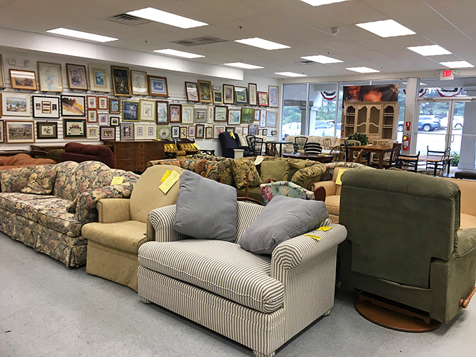 An art gallery of forgotten frames watches over a gathering of sofas that have stories to tell—if only they could talk.