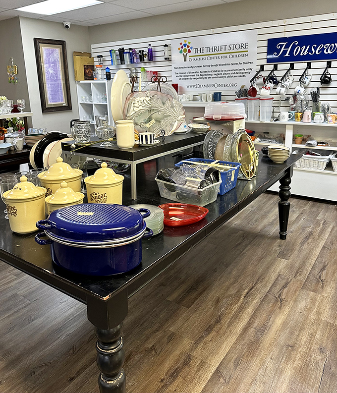 Kitchen treasures arranged with care. That cobalt Dutch oven isn't just cookware—it's the beginning of countless family meals waiting to happen.
