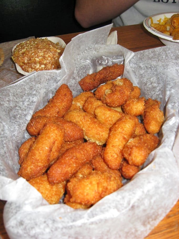 These golden-brown hush puppies aren't side characters in the barbecue story—they're supporting actors worthy of their own Oscar.