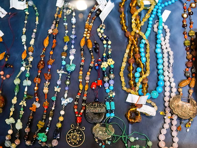 A kaleidoscope of vintage beads and pendants awaits new life. One person's forgotten necklace is another's statement piece at the next family reunion. 