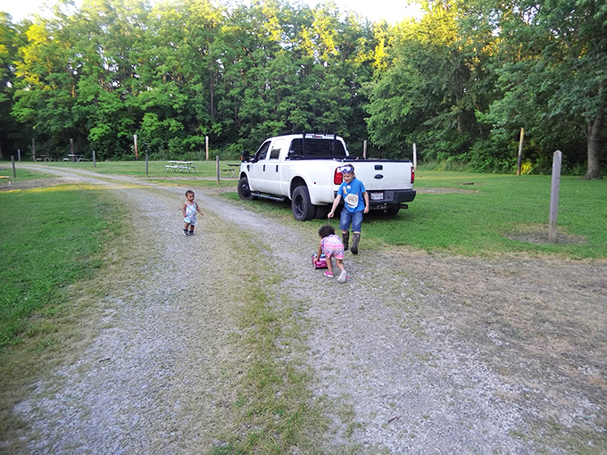 Childhood unplugged—the way we all grew up. Kids exploring gravel paths prove the best entertainment doesn't require batteries or Wi-Fi.
