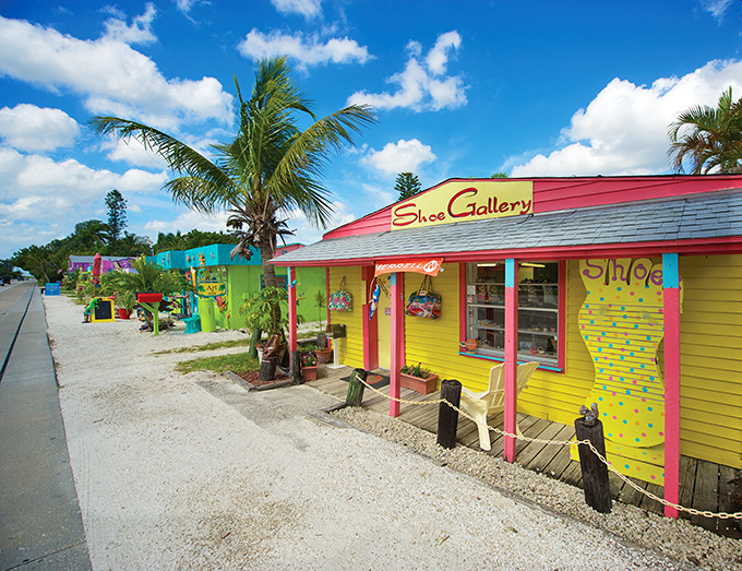 The Shoe Gallery stands as a cheerful beacon among Matlacha's rainbow row of shops—proving Florida knows how to dress up a sidewalk.