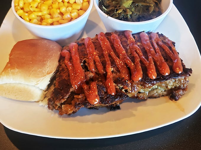 Meatloaf drizzled with tangy sauce alongside buttery corn and greens—proof that the classics never go out of style for good reason.