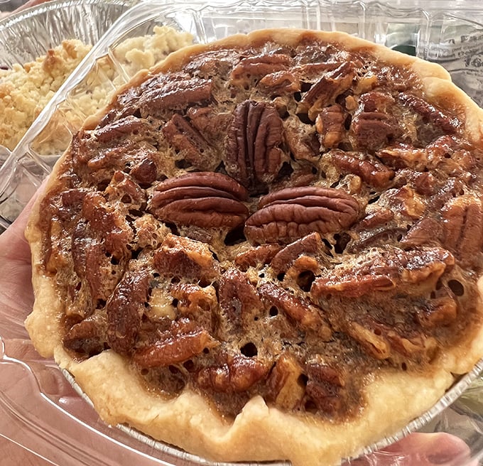 This pecan pie isn't just dessert—it's architecture. Those perfectly arranged pecans are like the Sistine Chapel of baked goods.