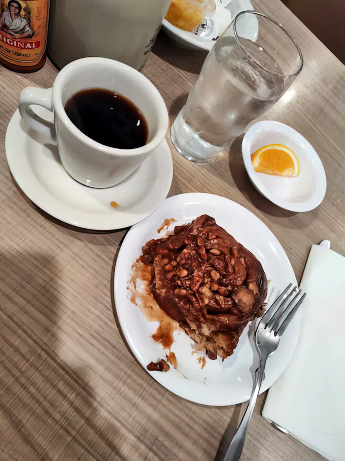 This isn't just coffee and a roll—it's morning salvation. The sticky pecan roll has that perfect balance of gooey center and caramelized edges.