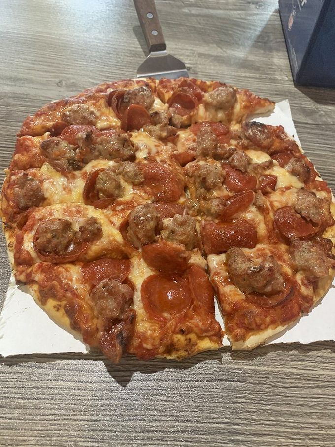 The marriage of pepperoni and sausage on this pie isn't just a topping combination – it's a flavor partnership worthy of relationship goals.