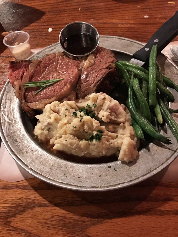 The star of the show: perfectly roasted prime rib served with mashed potatoes and green beans—a trio so classic, they should be in the Culinary Hall of Fame.