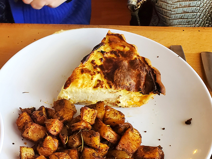 This quiche doesn't just sit there looking pretty – it stands tall with confidence, knowing it's about to rock your breakfast world alongside those herb-roasted potatoes.