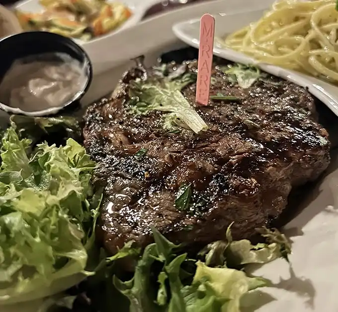 Even the ribeye gets the royal treatment here, perfectly seasoned and char-grilled with the confidence of a kitchen that knows exactly what it's doing.