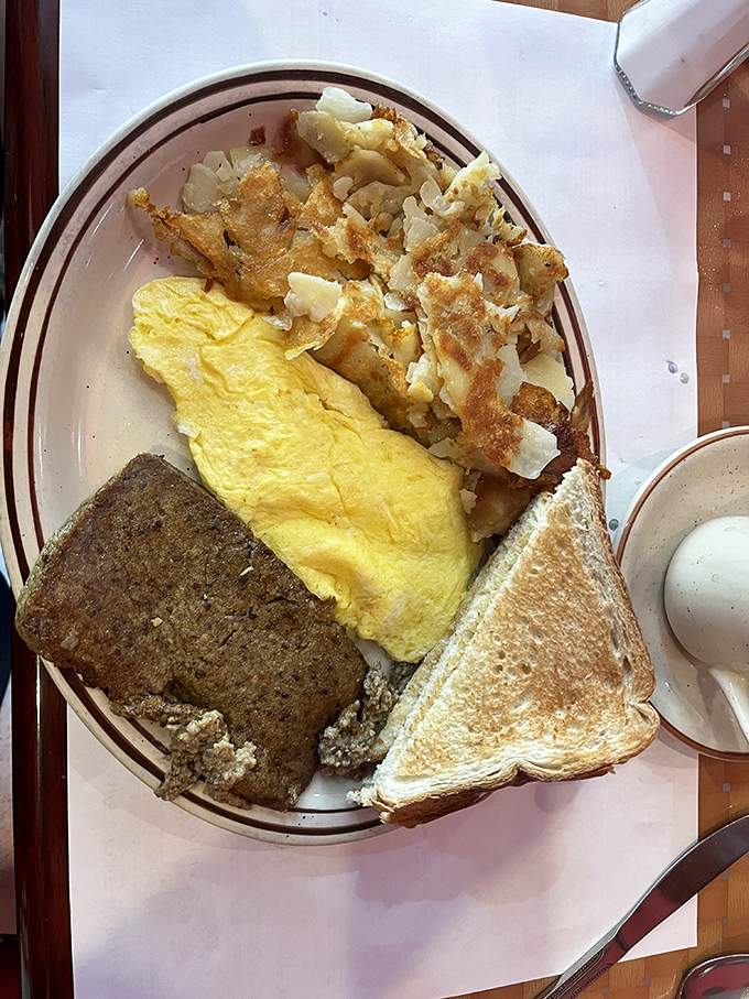 This isn't just breakfast—it's a Delaware morning ritual. Scrapple, eggs, and home fries: the breakfast of champions who aren't counting cholesterol.