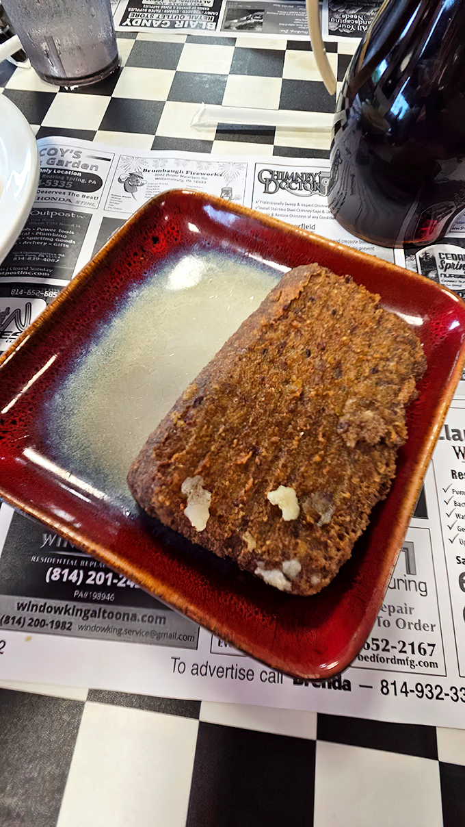 Scrapple on a ceramic plate – Pennsylvania's breakfast of champions that divides families but unites true diner aficionados.