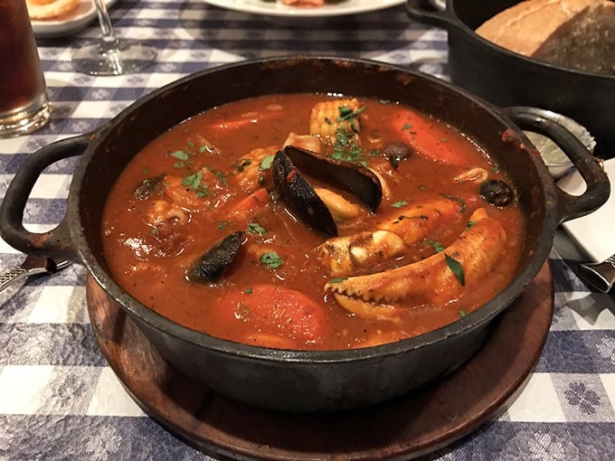 Cioppino that would make Italian fishermen weep with joy—a tomato-rich symphony of seafood that demands bread for the final encore.