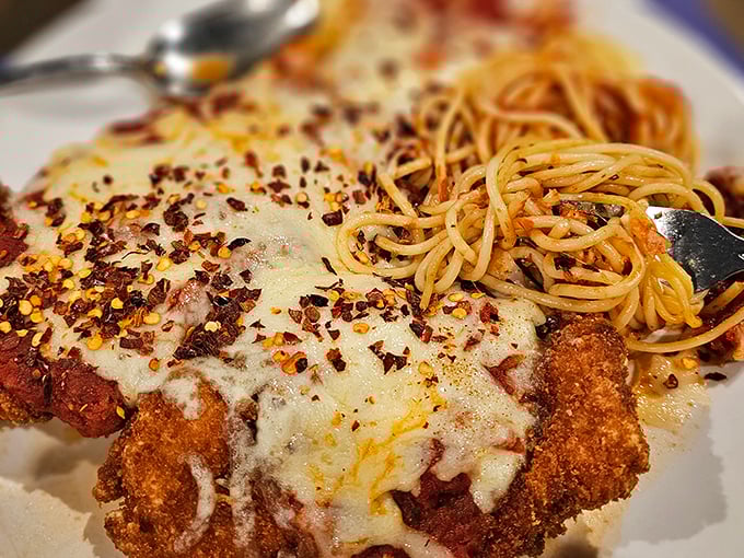 This isn't just chicken parmesan—it's what other chicken parmesans aspire to be when they grow up. The crispy coating deserves its own fan club.