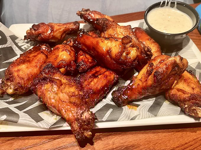 Smokey Bones' wings arrive looking like they've been dipped in a sunset—crispy, caramelized, and begging for their close-up.
