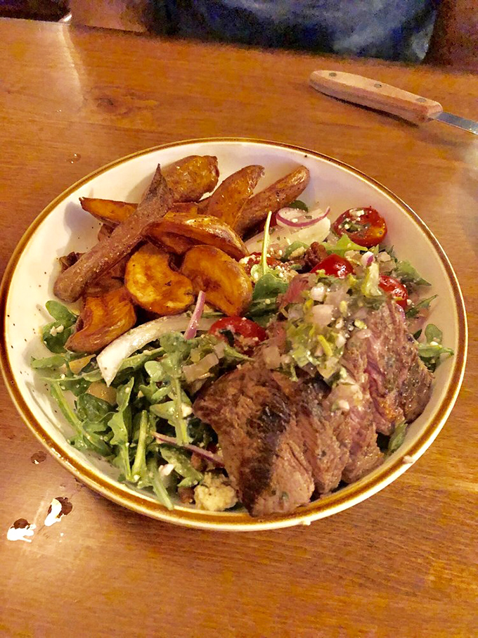 Perfectly seared steak alongside golden root vegetables—proof that simple food done right can outshine the fanciest molecular gastronomy any day.
