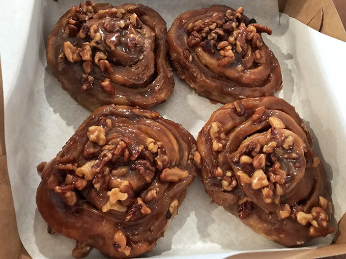 These sticky buns aren't just dessert – they're an experience worth driving for, with walnuts standing guard over caramelized perfection.