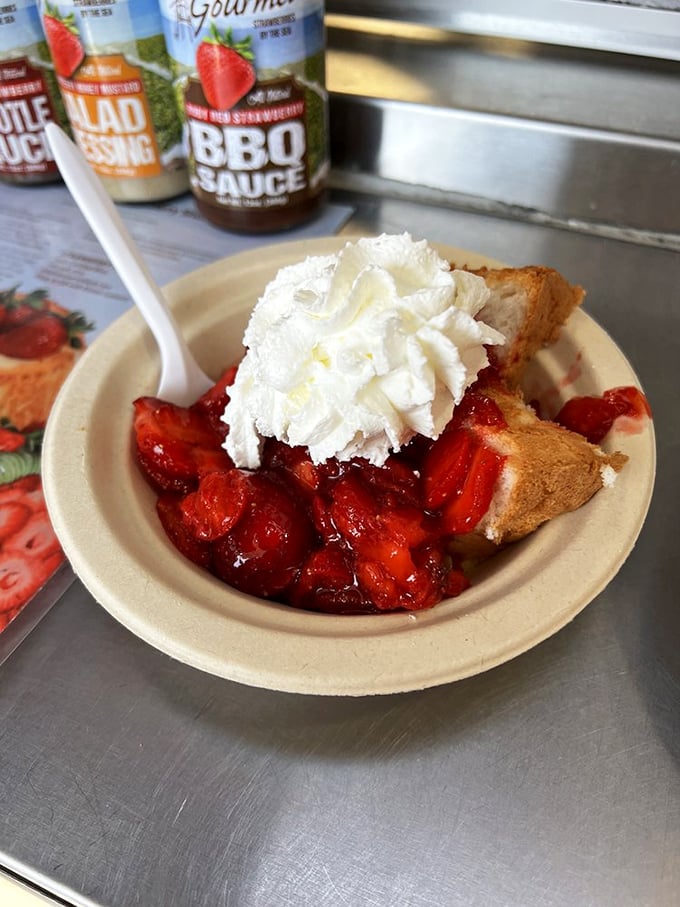 Behold the strawberry shortcake that launched a thousand road trips – generous berries drowning in real whipped cream perfection.