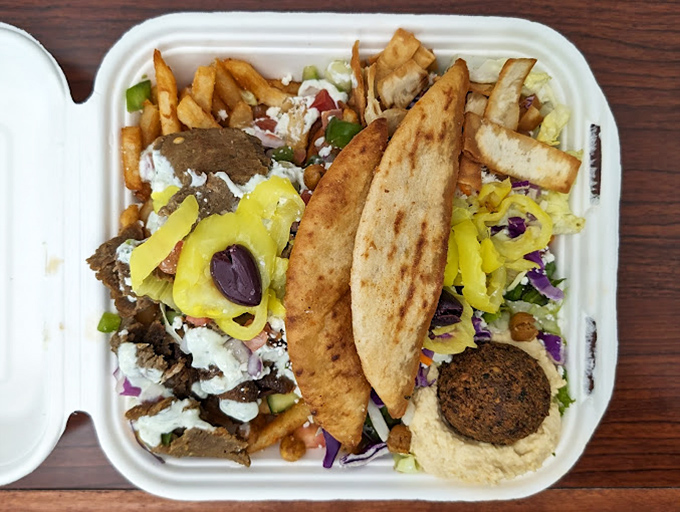 A Mediterranean feast in a takeout container – falafel, hummus, and vibrant veggies create a portable party that puts sad desk lunches to shame.