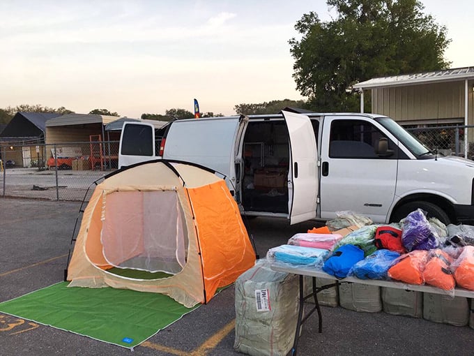 Dawn setup at Webster reveals vendors' mobile storefronts, where tents and trucks transform into specialty boutiques under the open sky.