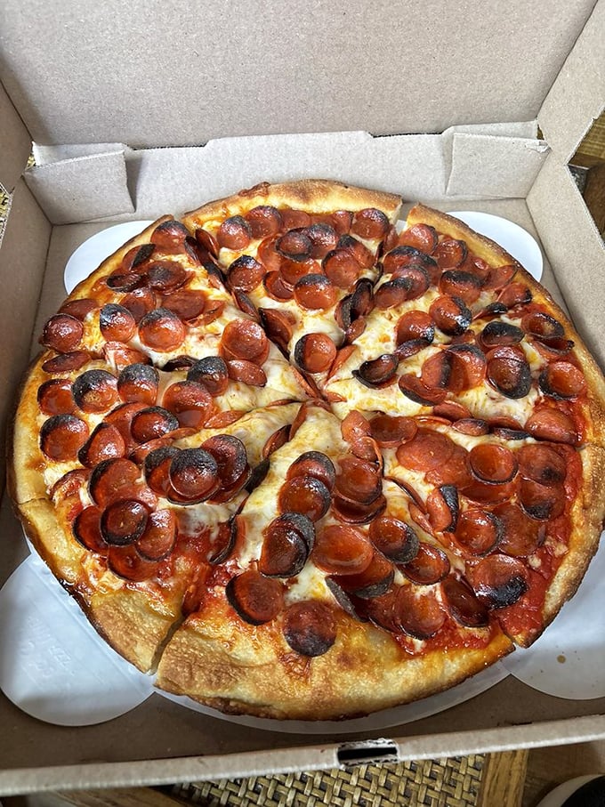 The pepperoni pizza doesn't just have toppings – it has perfectly crisped cups of pepperoni performing a delicious dance across a sea of melted cheese.