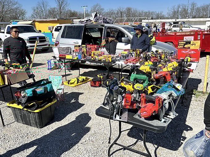 Tools of every trade imaginable spread across folding tables – a hardware store exploded and rearranged itself by some cosmic yard sale logic.