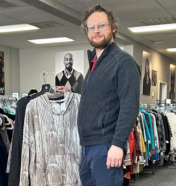 The thrill of the hunt captured in action—a shopper discovers that perfect piece that seems destined for their wardrobe.