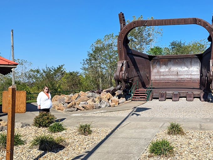 For scale, notice how visitors appear dollhouse-sized next to this behemoth—it's like standing beside a dinosaur that ate bulldozers for breakfast.