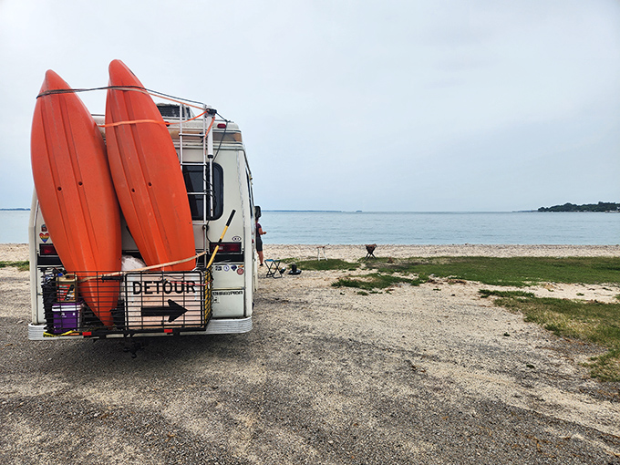 Adventure-mobile parked and ready! Those bright kayaks aren't just transportation—they're your ticket to discovering Kelleys Island's hidden coves.