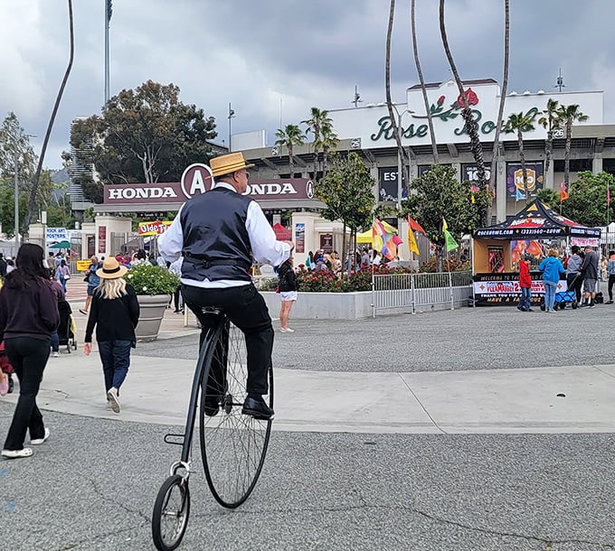 Where fashion meets history on two wheels. This dapper gentleman on a penny-farthing bicycle adds unexpected Victorian flair to the modern treasure hunt.