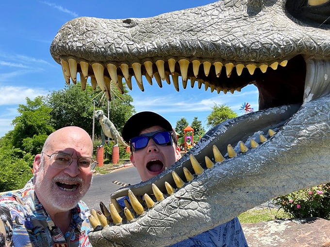 Nothing says "memorable vacation" like sticking your head inside a dinosaur's jaws—a photo opportunity that's been making travelers smile since roadside attractions began.