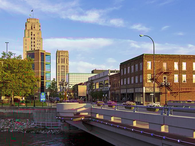The golden hour bathes Battle Creek's downtown in warm light, highlighting the city's architectural gems along the river.