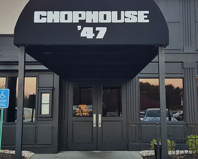 The sleek black exterior hints at the old-school steakhouse experience waiting inside. Rat Pack approved!