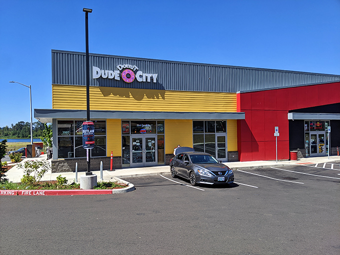 Dude Donut City's bold yellow facade brightens any Salem morning. Like sunshine in building form – with donuts!