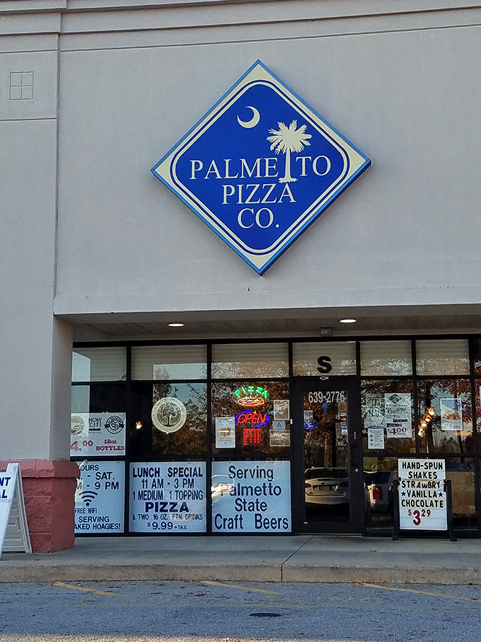 Palmetto Pizza proudly flies South Carolina's flag on its sign—a local landmark serving slices that make state residents stand a little taller.