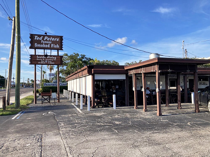 Ted Peters' weathered sign has guided smoke-lovers for generations. When you smell that oak smoke, you know you're close.