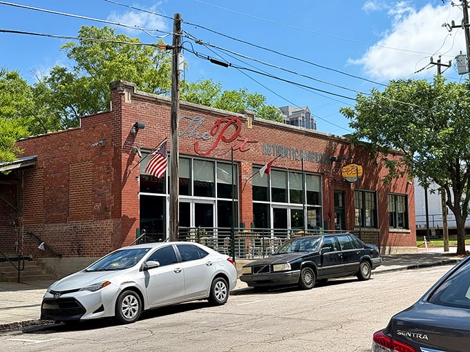 The Pit's unassuming brick exterior hides culinary treasures within – like finding a Picasso in your grandma's attic, but tastier.