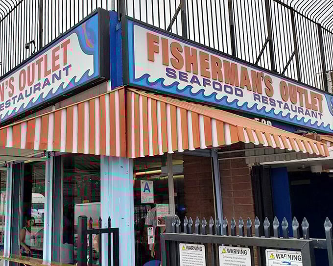 The orange-striped awning at Fisherman's Outlet isn't just eye-catching—it's a beacon guiding hungry souls to seafood salvation.