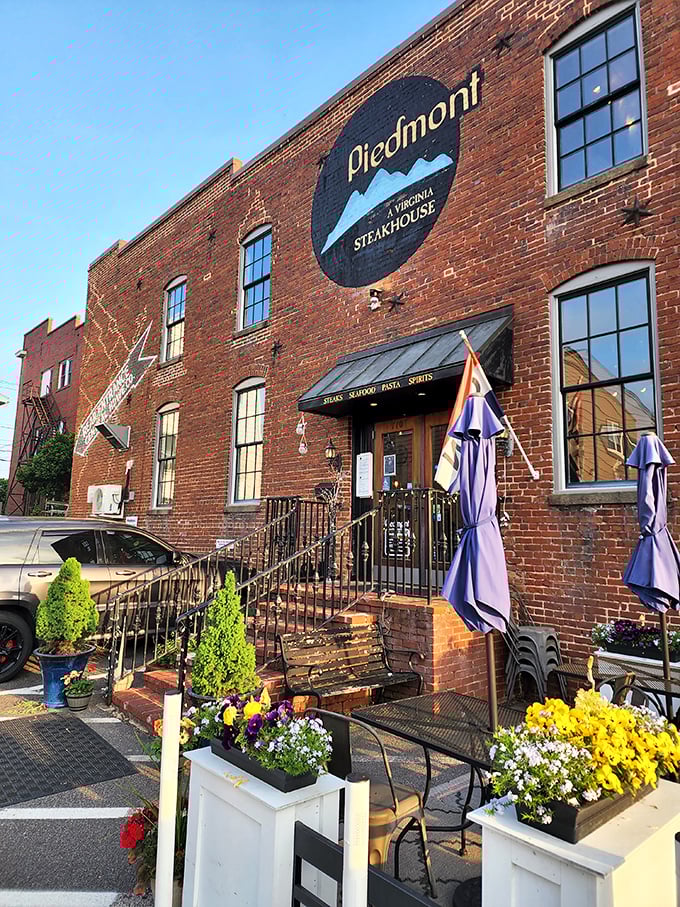 Spring flowers frame the entrance to Piedmont's brick fortress of flavor. Those steps lead to steak nirvana—come hungry, leave happy.