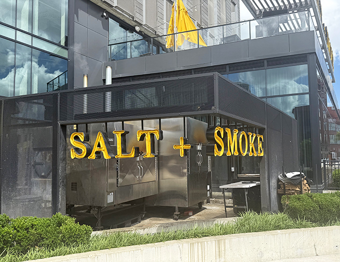 Those golden letters against steel gray? It's like the building is saying, "Yes, we're serious about flavor."
