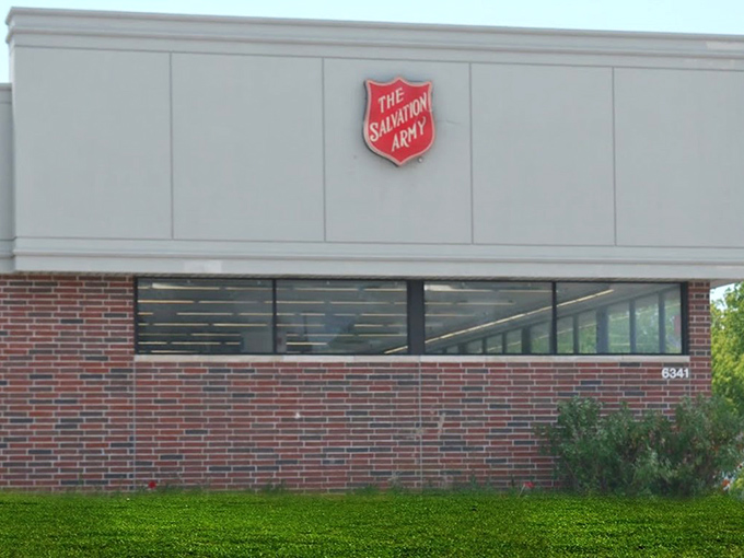 That iconic red shield signals not just a thrift store, but a community mission disguised as a bargain hunter's paradise.