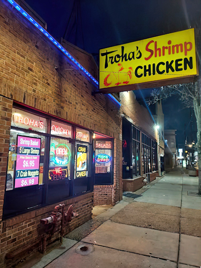 By day or night, Troha's neon-lit storefront beckons with the promise of perfectly fried seafood treasures.