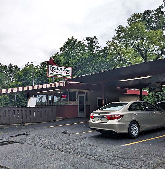 The red and white awning at Wot-A-Dog isn't just sheltering cars—it's protecting a delicious Ohio tradition.