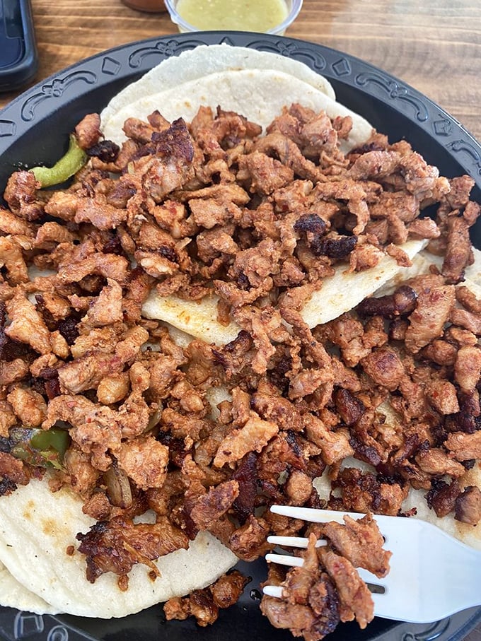 These adobada tacos aren't just food – they're edible love letters from Mexico. The marinade speaks a language everyone understands.