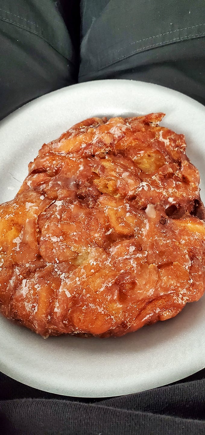 The apple fritter—a craggy, caramelized masterpiece of apple-studded dough that makes other breakfast pastries seem like mere warm-up acts.